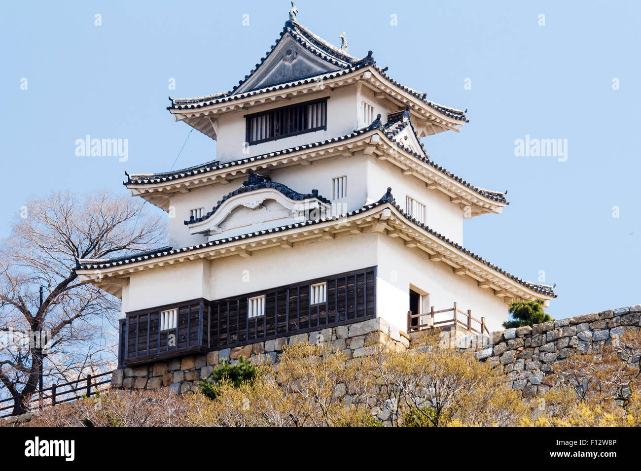 Castle keep at Marugame in Japan. Three story original hilltop sotogata ...