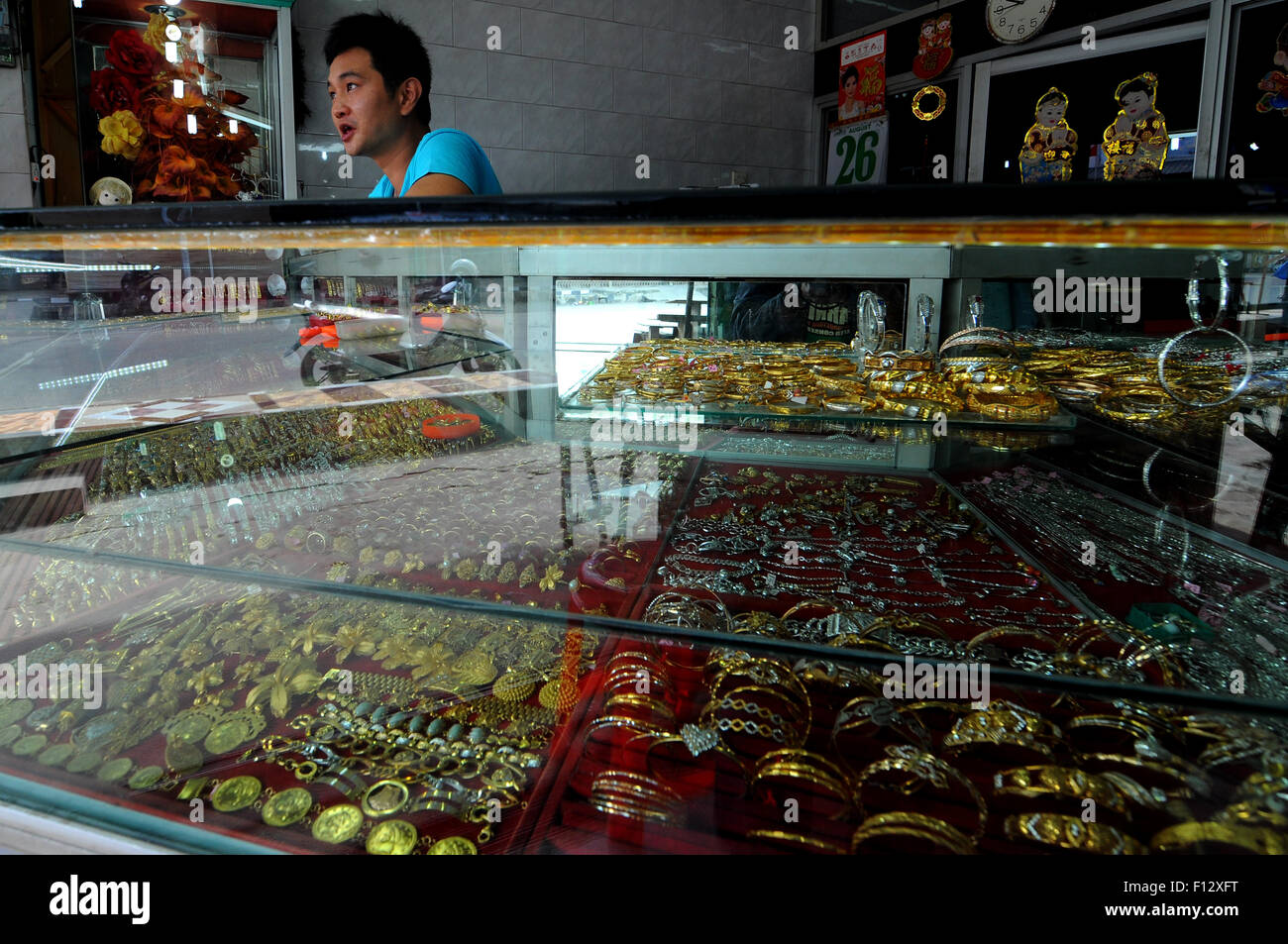 Lhokseumawe, Indonesia. 26th Aug, 2015. An owner of a gold shop in ...