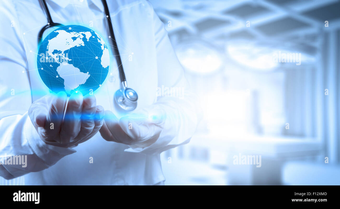 Medical Doctor holding a world globe in his hands as medical network ...