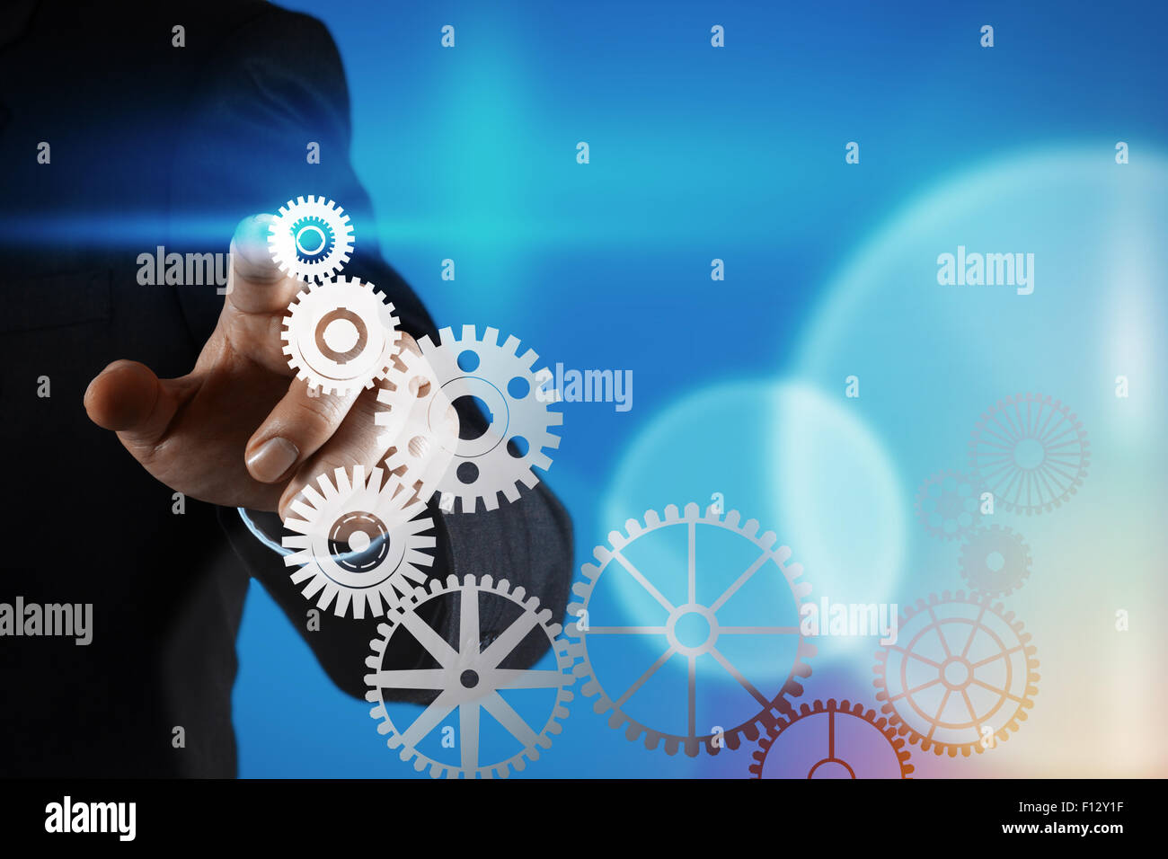 businessman hand draws gear to success concept Stock Photo - Alamy