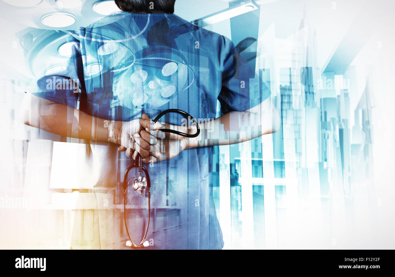 Double exposure of smart medical doctor working with abstract city as ...