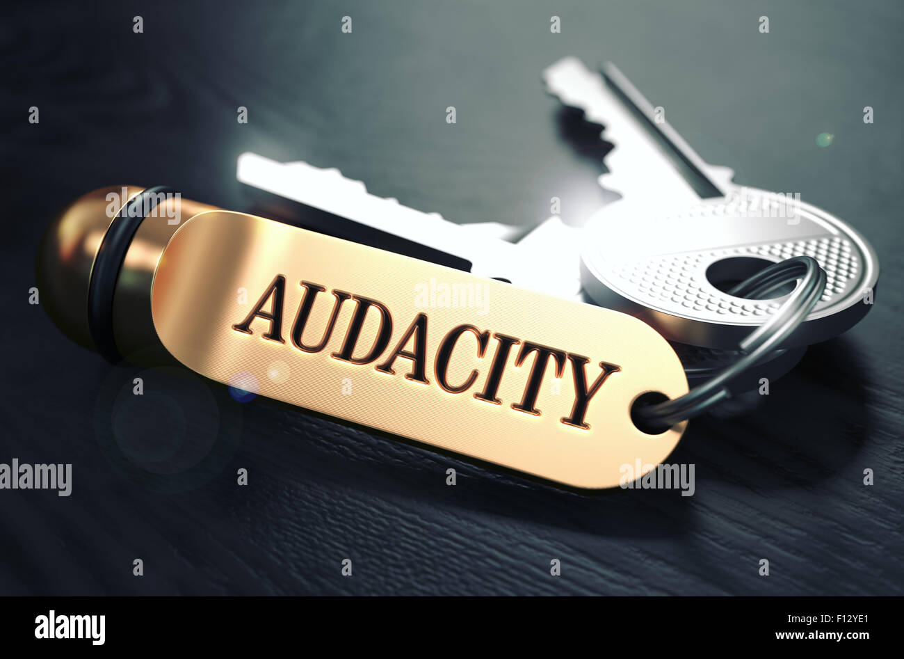 Keys with Word Audacity on Golden Label Stock Photo - Alamy