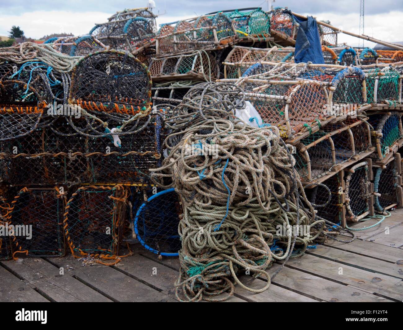 Piles of empty lobster pots,traps and rope Stock Photo - Alamy