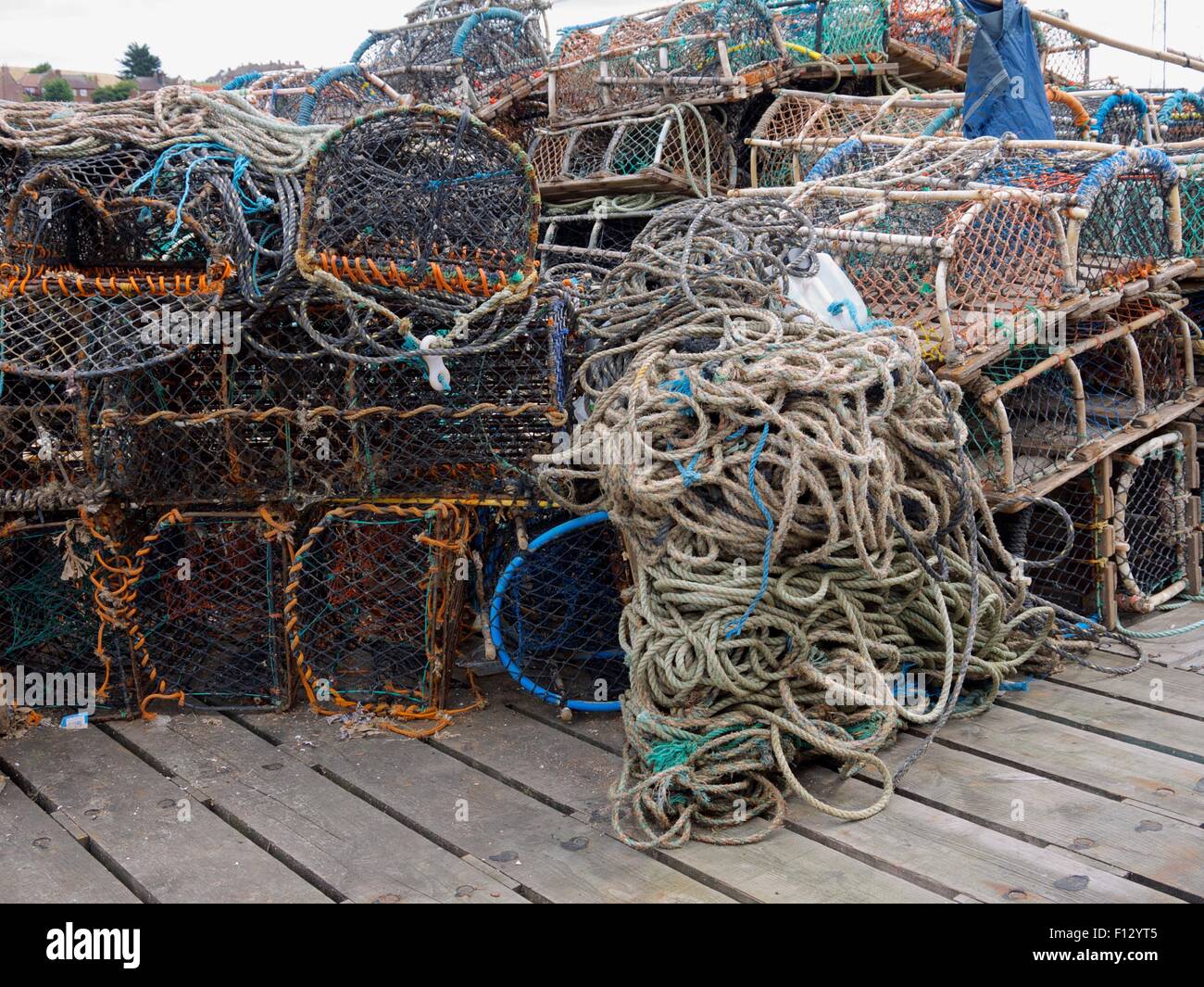 Piles of empty lobster pots, traps and rope Stock Photo - Alamy