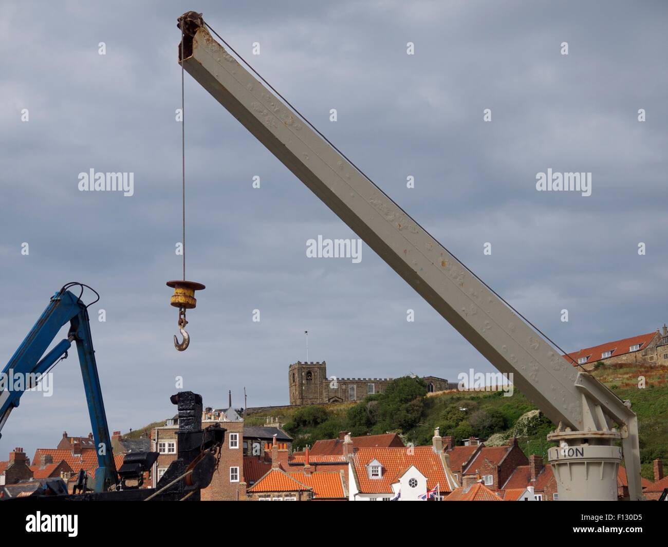 Crane to unload the catch from the fishing boats, houses and a church ...
