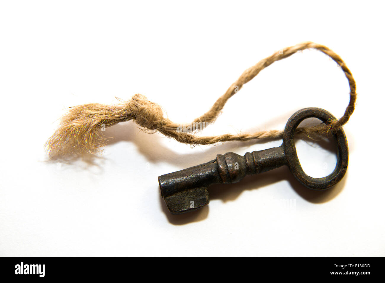 Very old key on a white background Stock Photo - Alamy