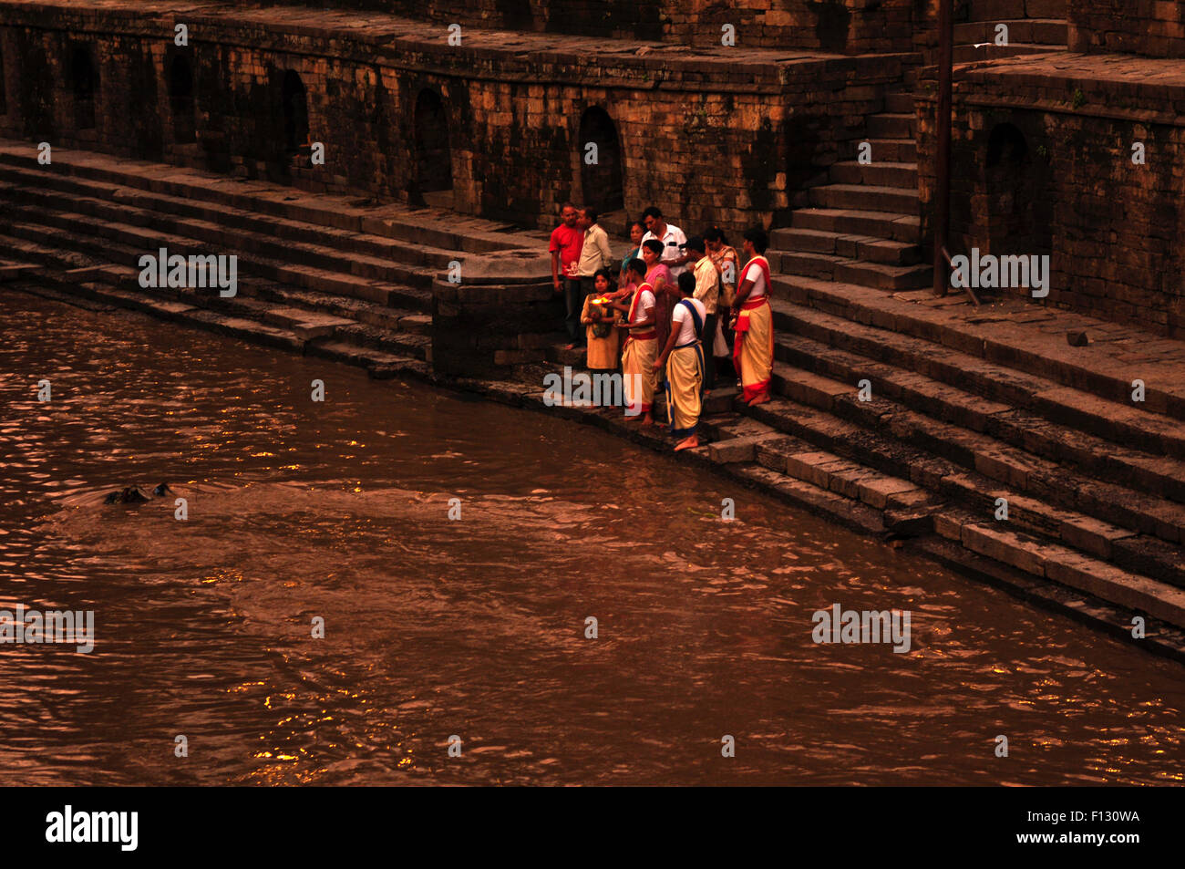 Hindu last rites - immersing the ashes of a loved one - a Hindu ritual ...