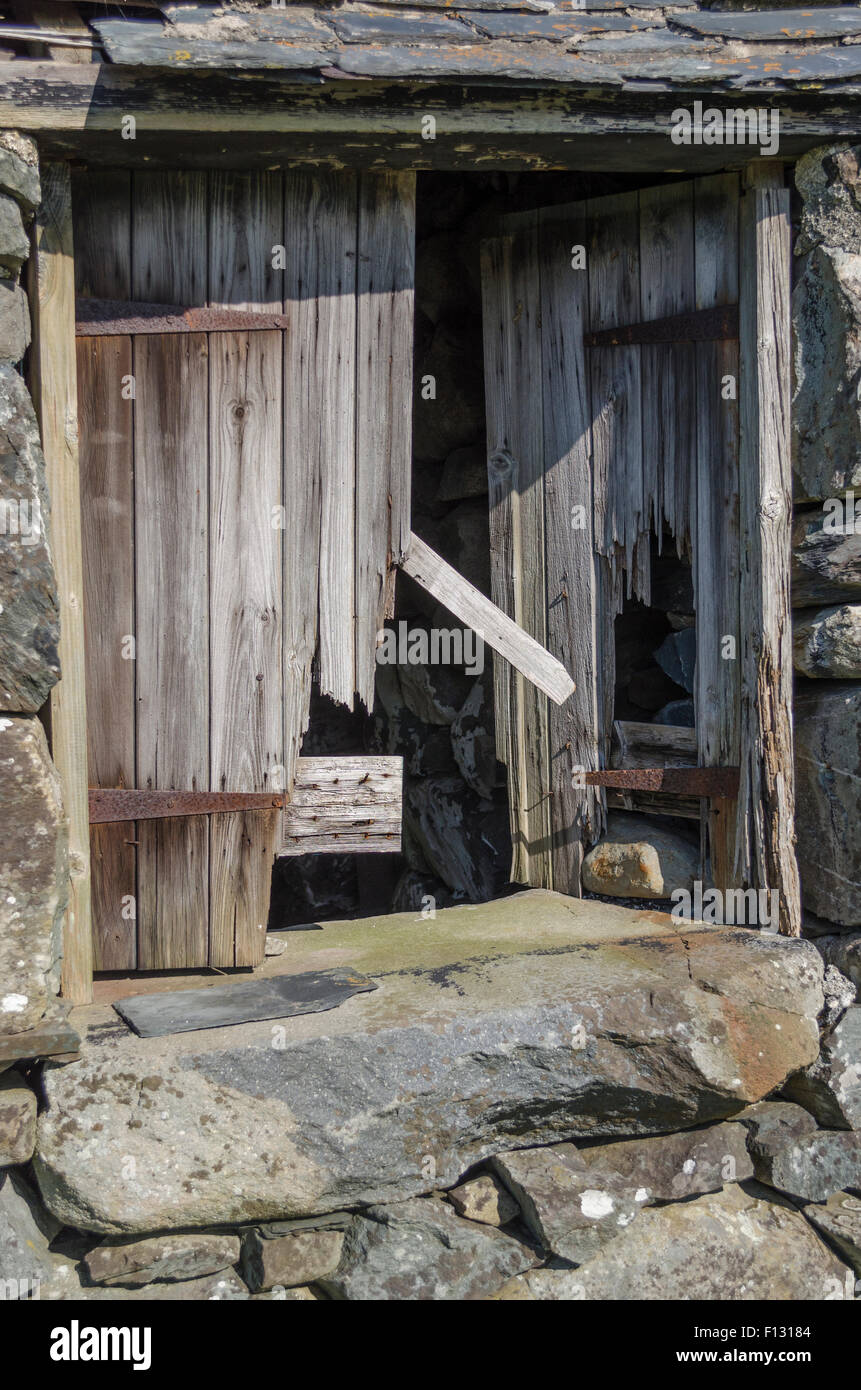 Rustic barn window with old, rotting doors Stock Photo - Alamy