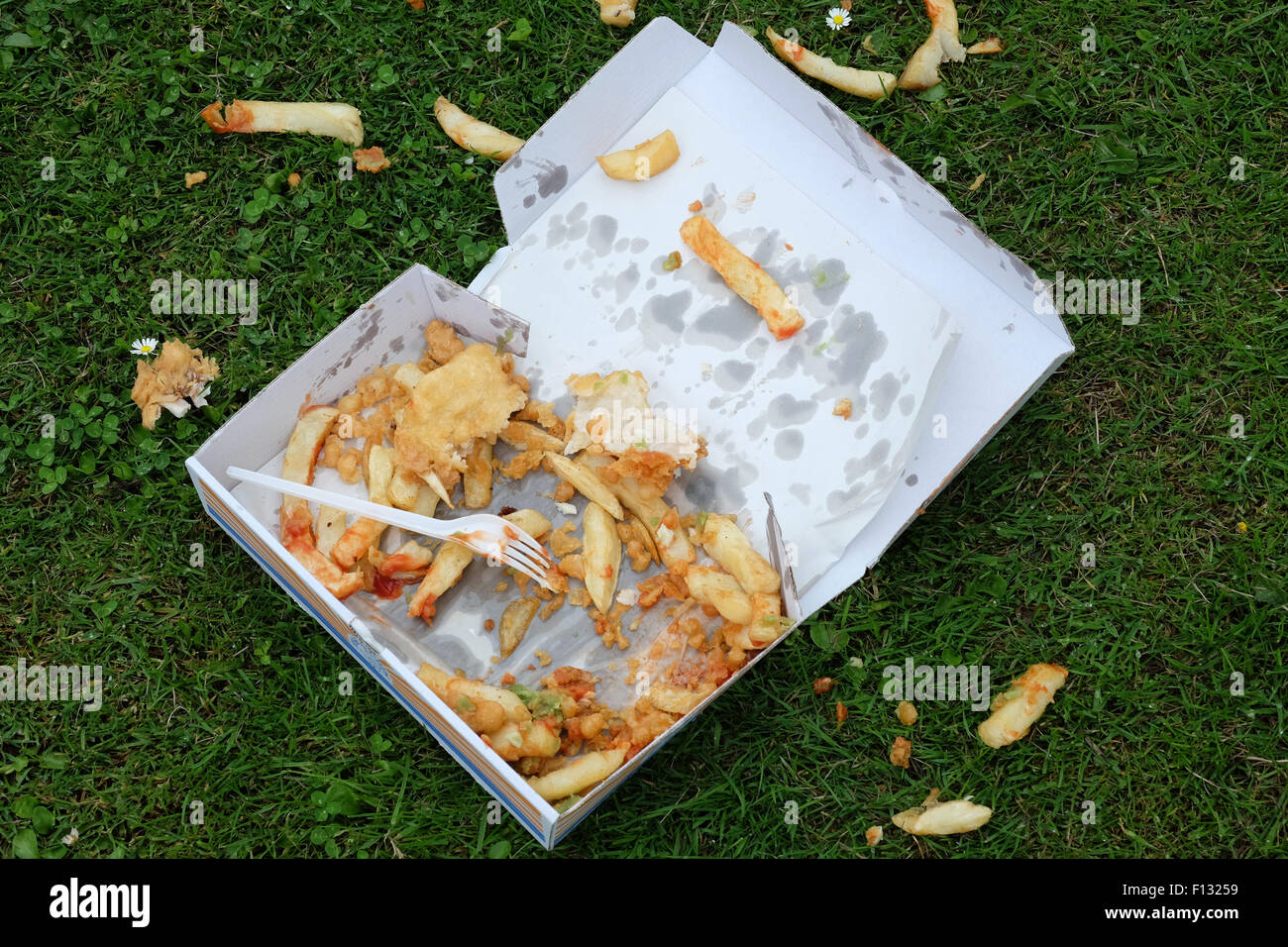 Discarded box of fast food on ground Stock Photo - Alamy