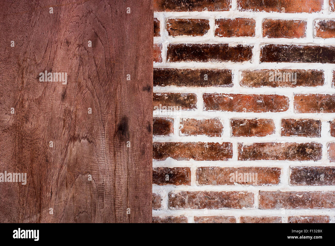 wooden board on brick with copy space Stock Photo - Alamy