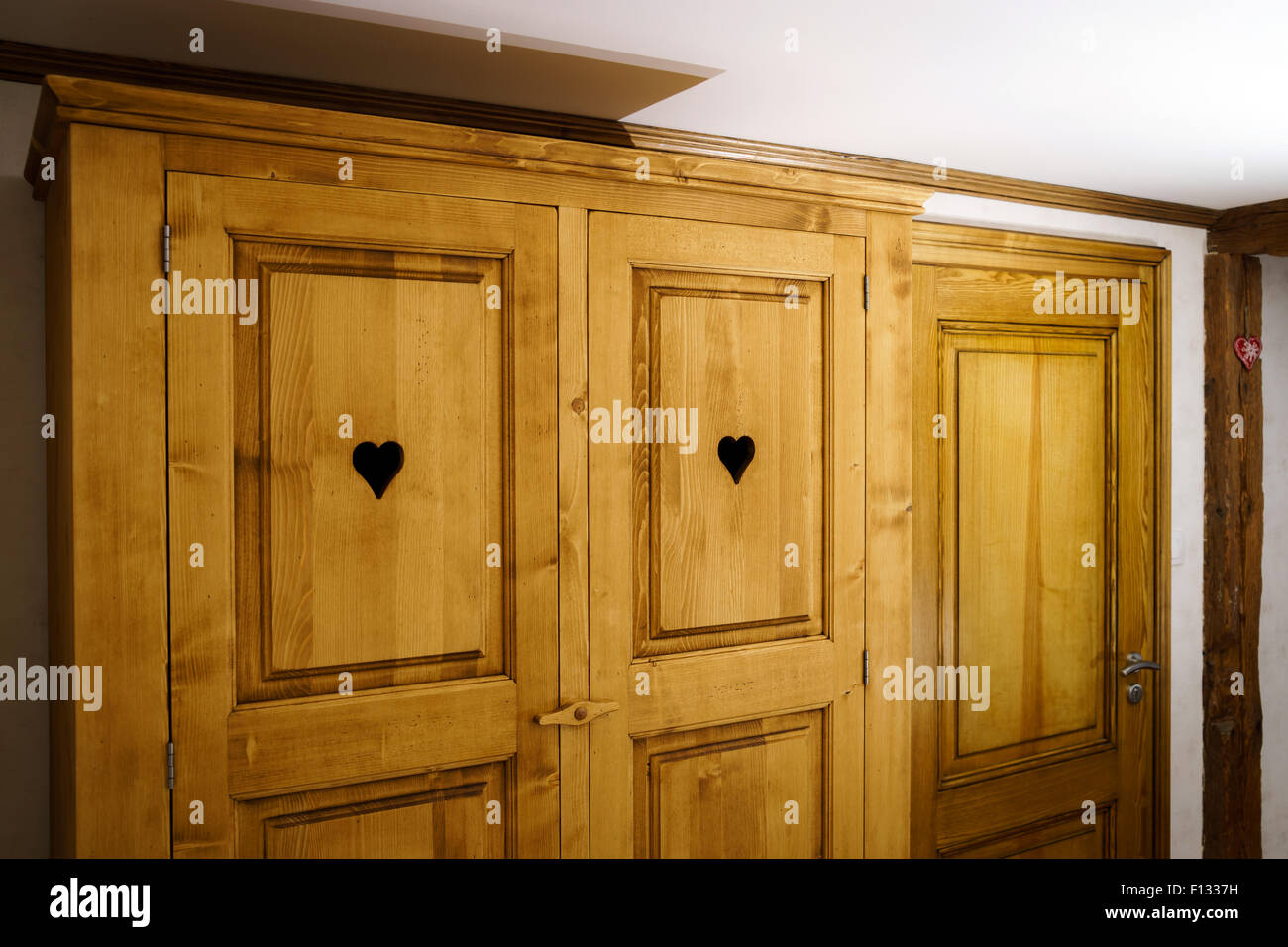 Classical wooden wardrobe in renovated old-style apartment, french ...