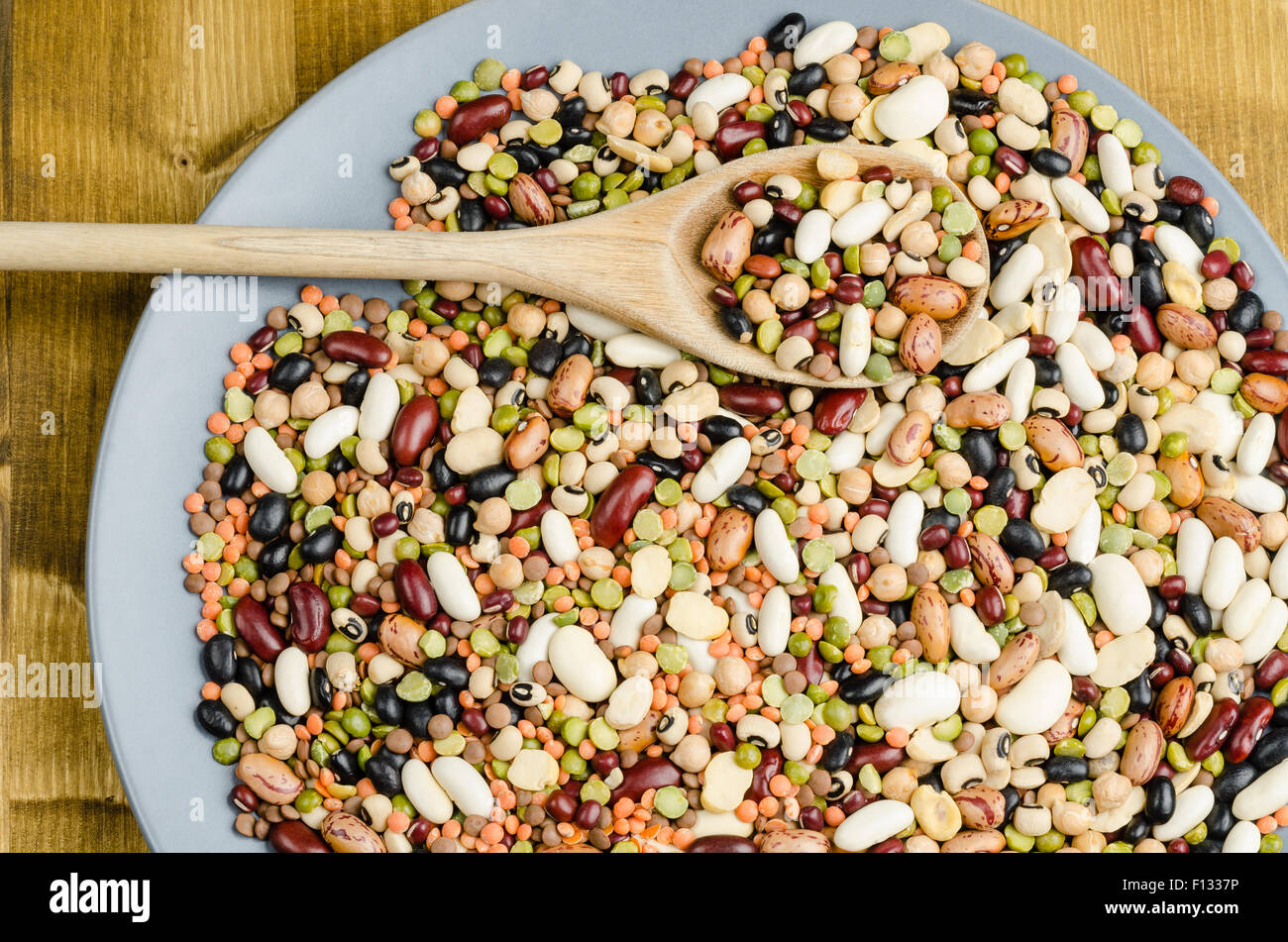 legumes in a dish on wood, close up, background Stock Photo - Alamy