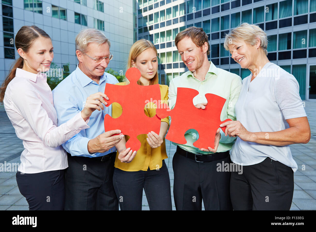 Group solving puzzle hi-res stock photography and images - Alamy