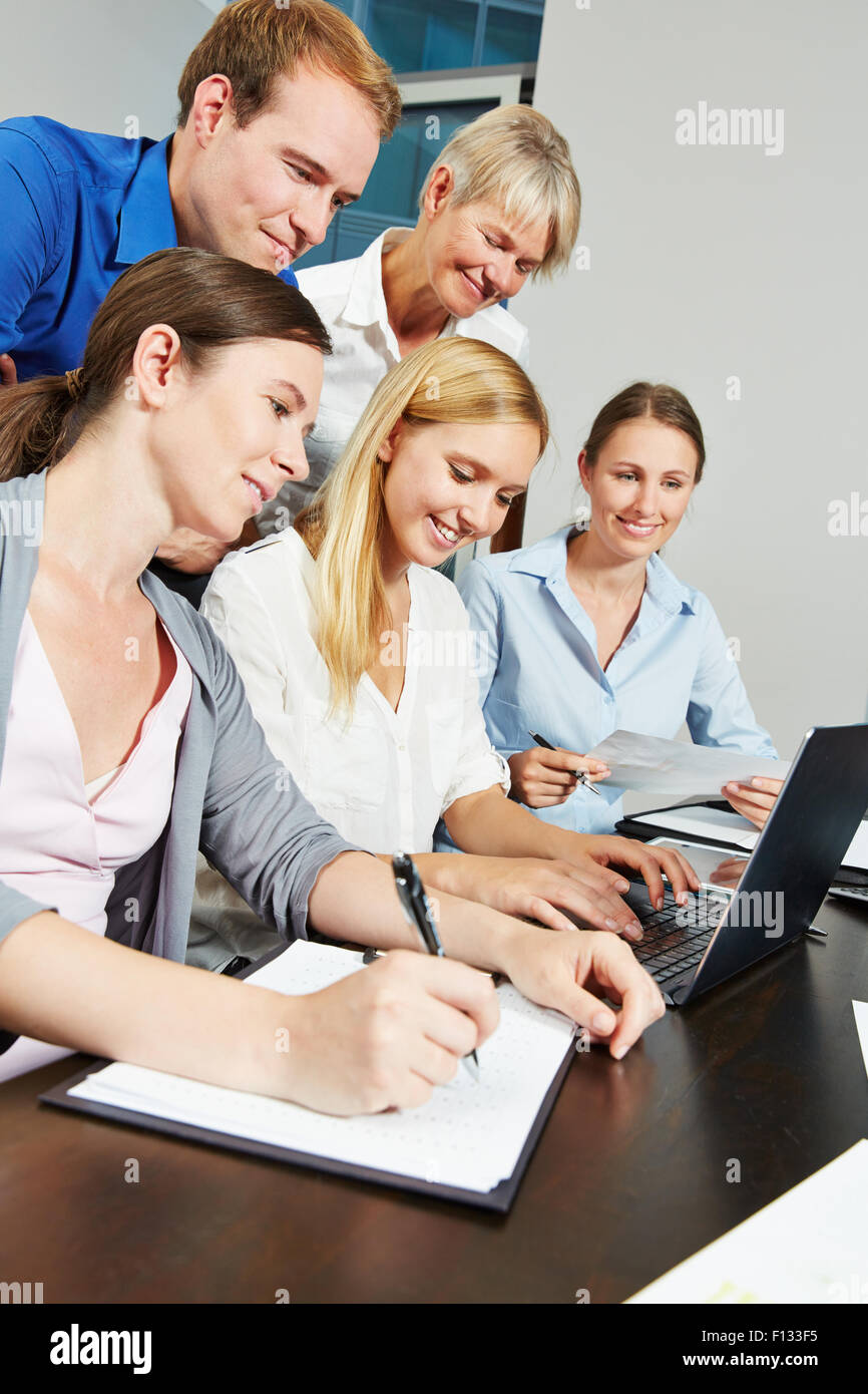 Business team using internet connection with laptop computer in the ...