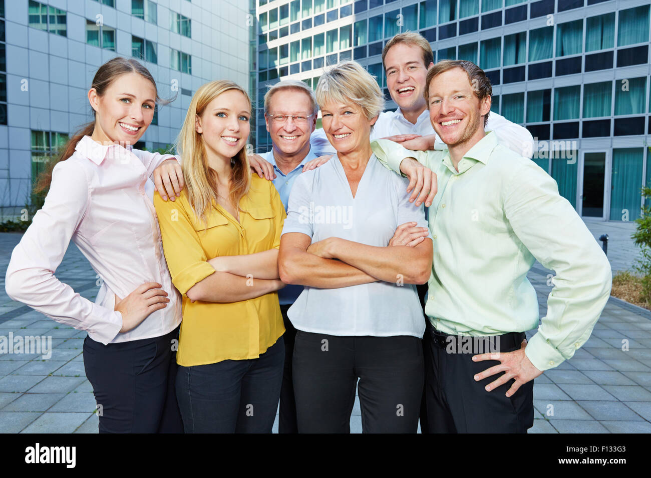 Happy employees and smiling staff members as a successful business team ...