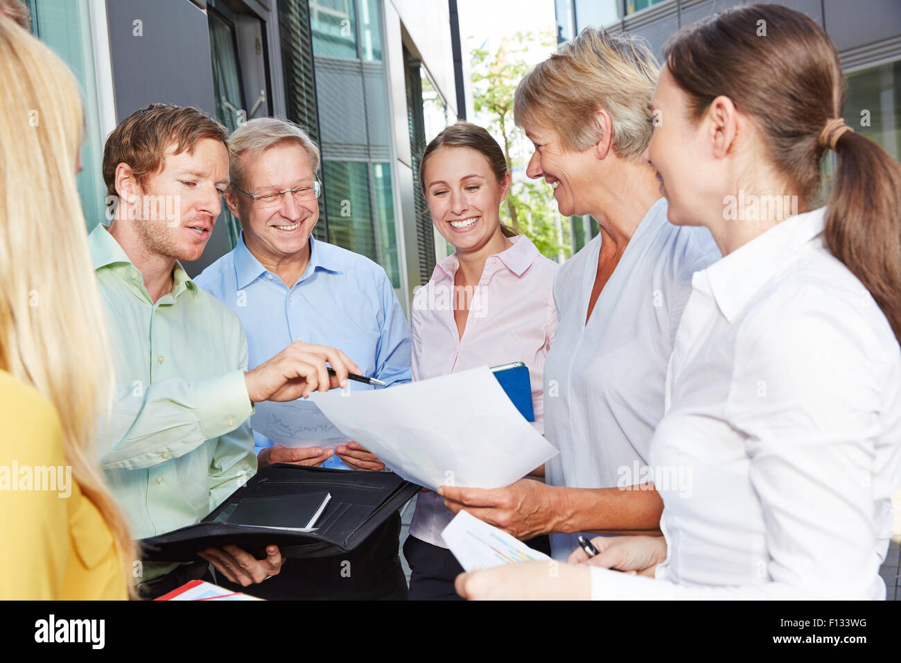 Planning and cooperation during business team meeting outdoors Stock ...