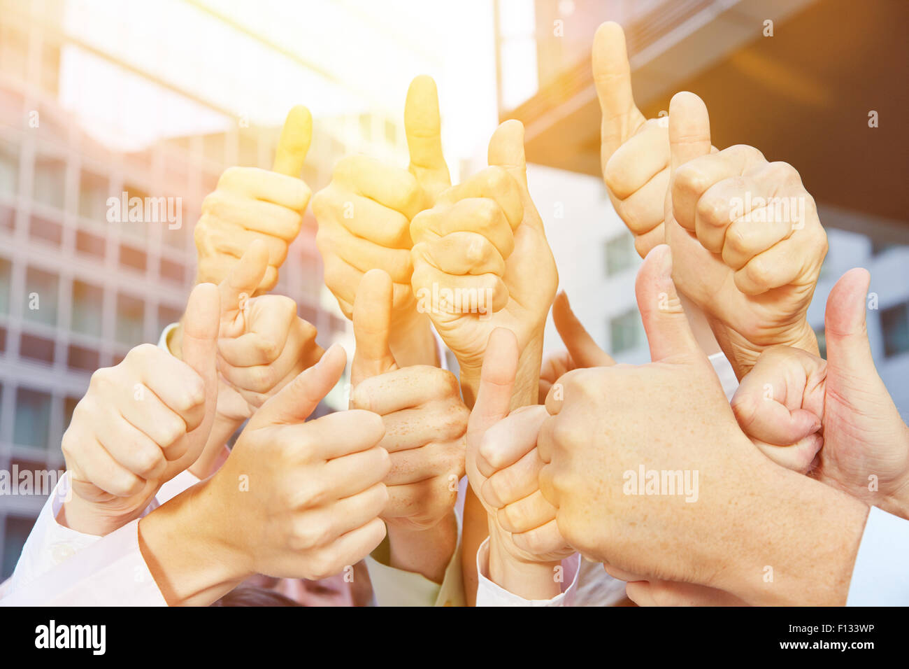 Fists together thumbs hands hi-res stock photography and images - Alamy