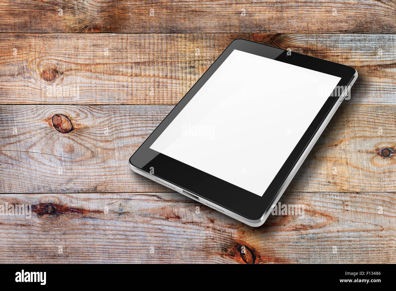 Tablet computer with blank screen on wooden background. Highly detailed ...