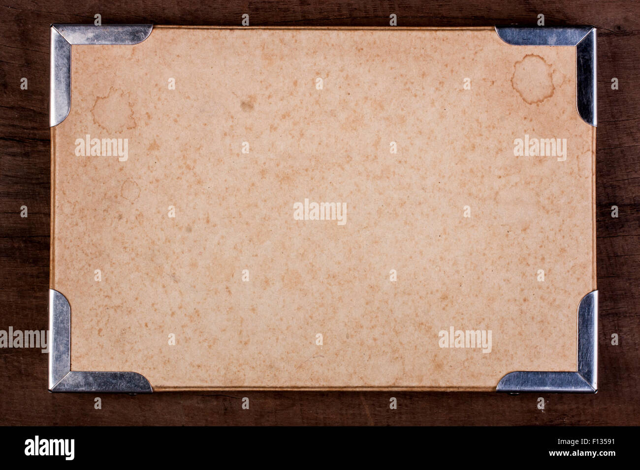 Paper box frame with metal corner on wooden table Stock Photo - Alamy