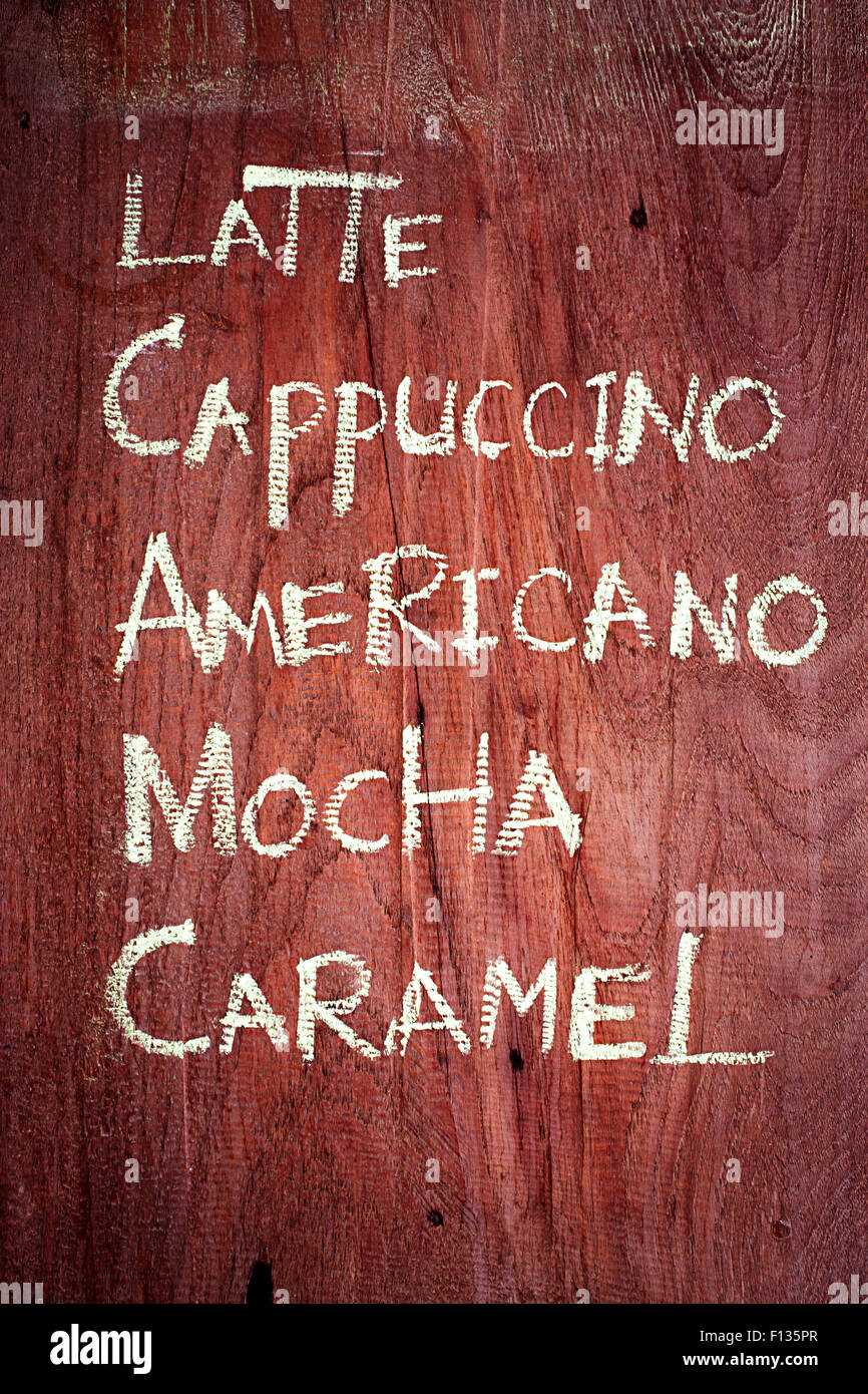 Coffee menu handwritten on a piece of wood Stock Photo - Alamy