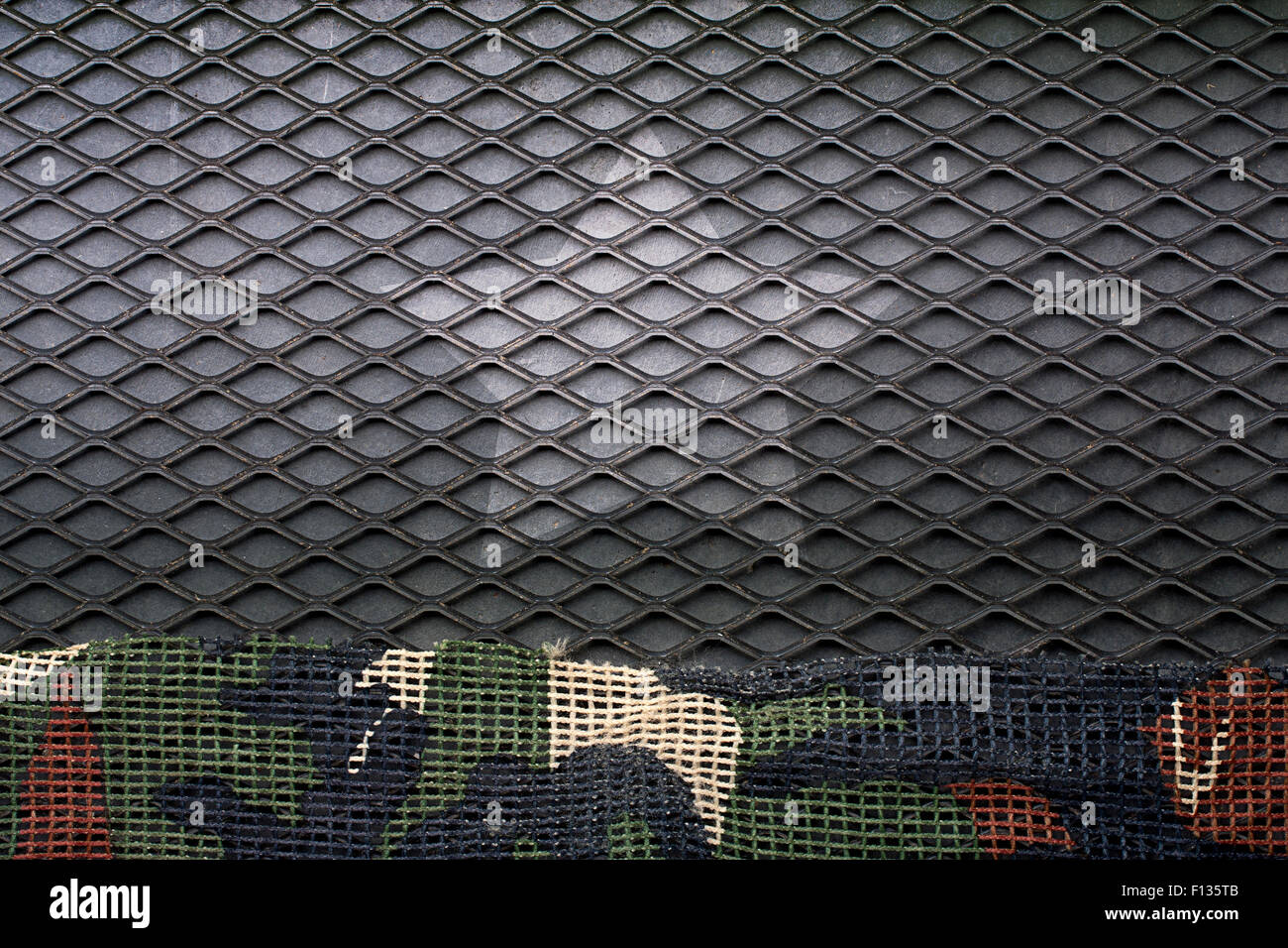 Element of military background on black grid steel Stock Photo - Alamy