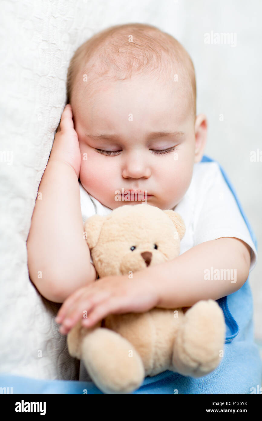 Cute sleeping baaby with teddy bear Stock Photo - Alamy