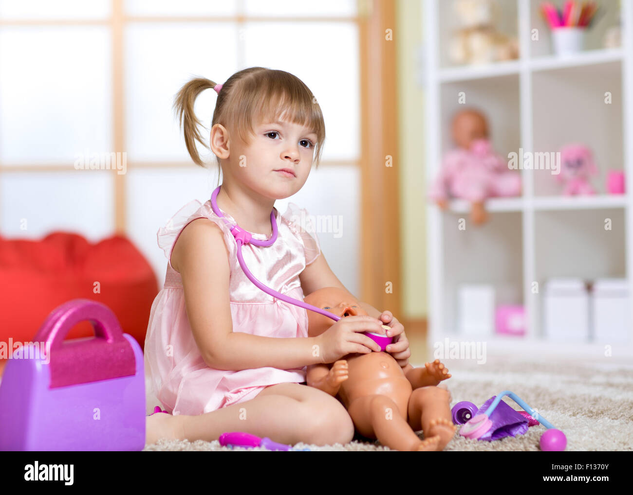 Little Girl Playing With Dolls Outside