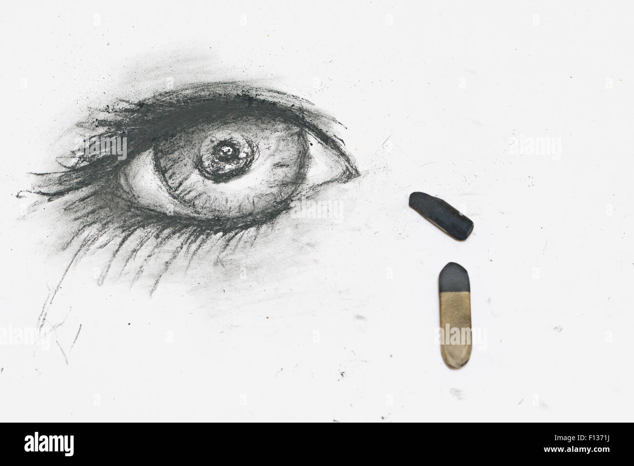 The human eye is drawn in charcoal on paper. The concept of creativity ...