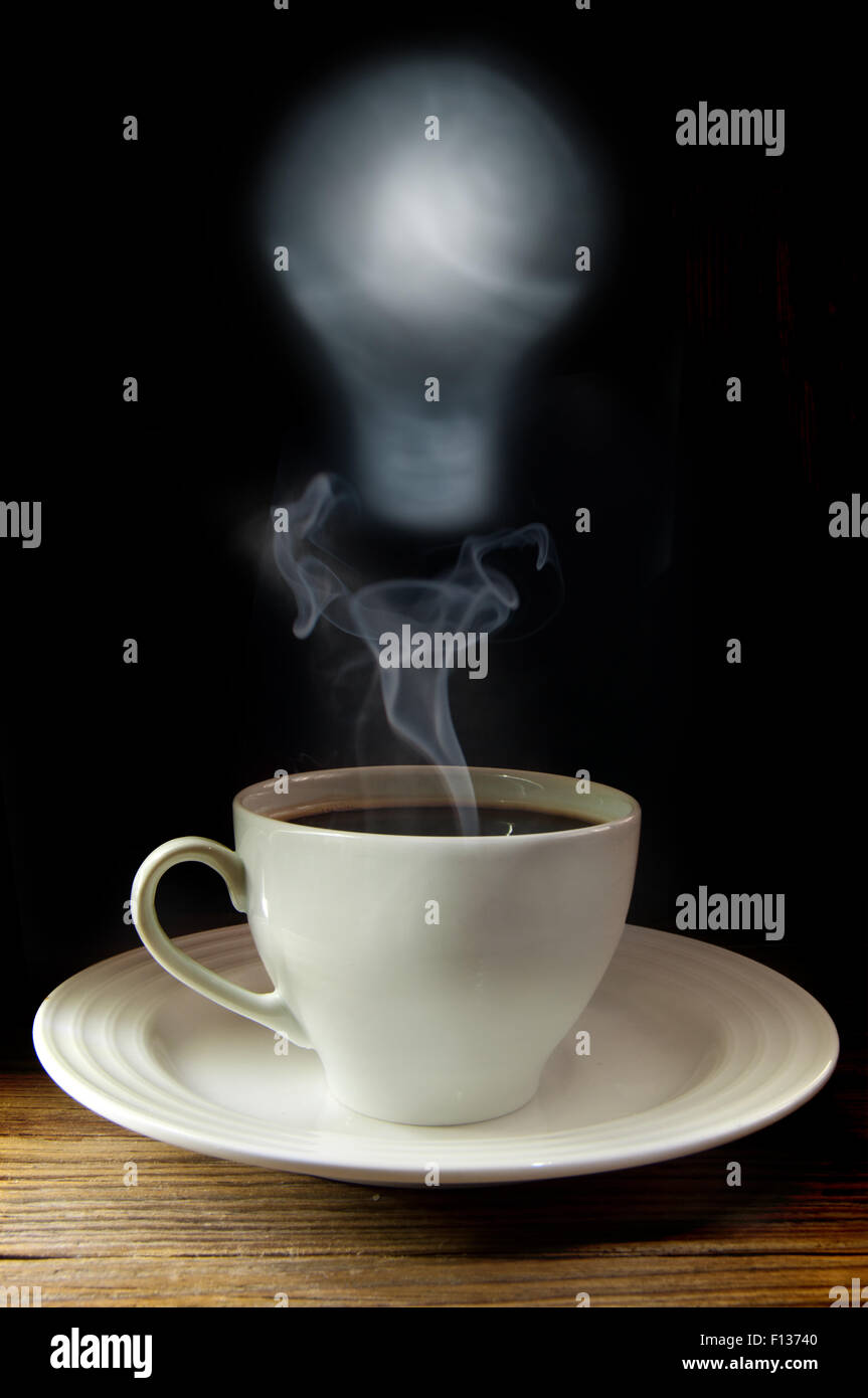 Hot coffee with steam forming the shape of a light bulb symbolising ...