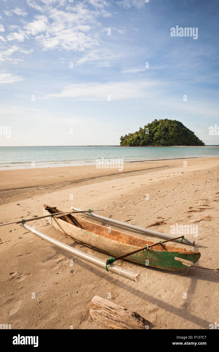 Small fishing boat exotic beach Stock Photo - Alamy