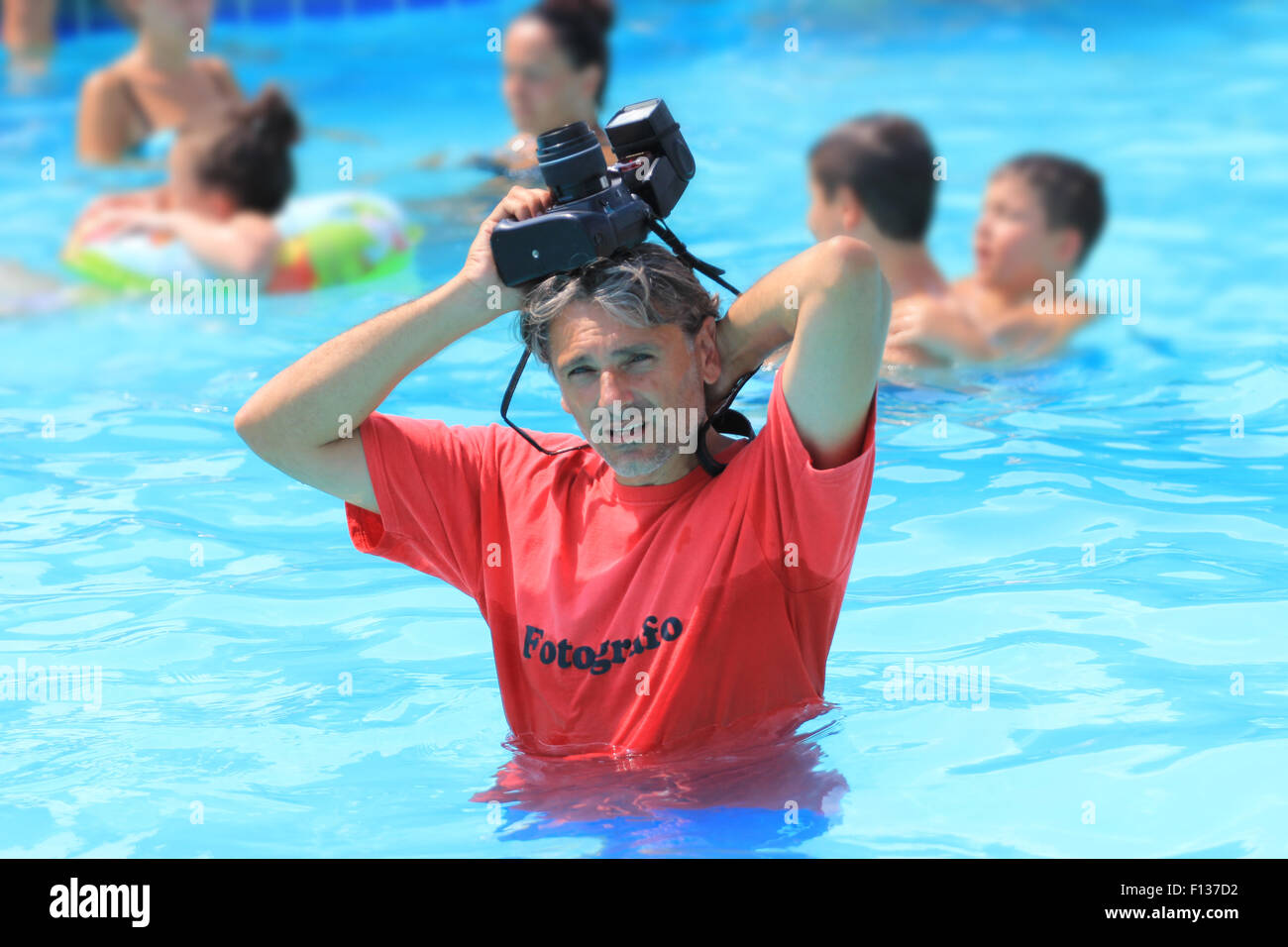 photographer in the swimming pool Stock Photo - Alamy