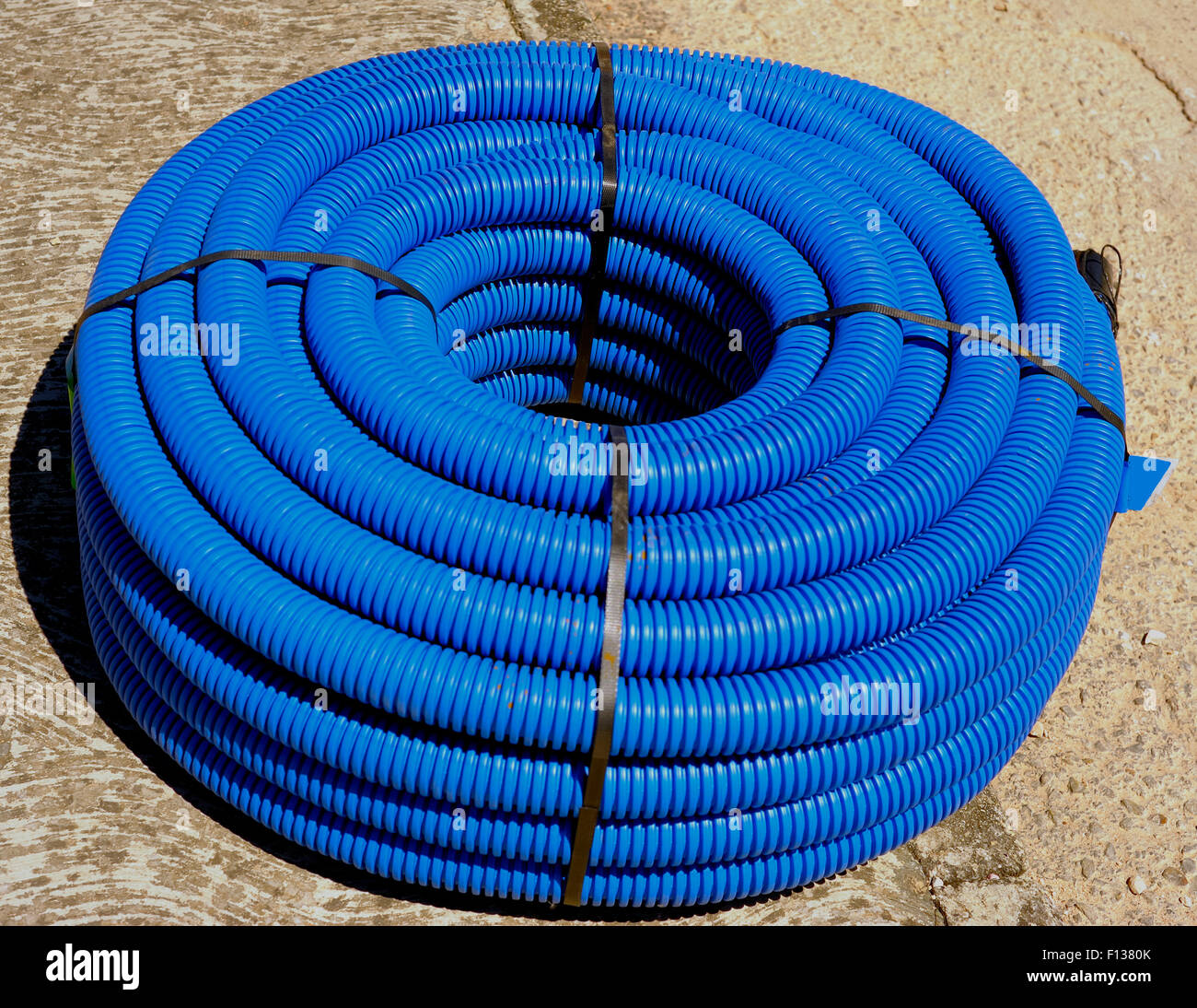 roll of corrugated conduit for microtrench in urban areas Stock Photo ...