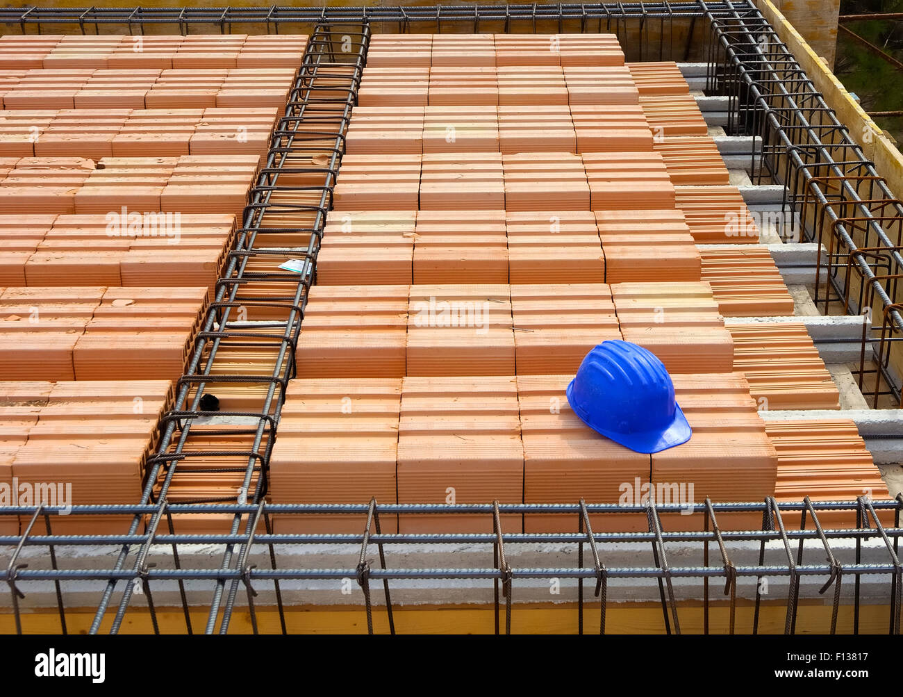 helmet placed construction of a slab and masonry Stock Photo - Alamy