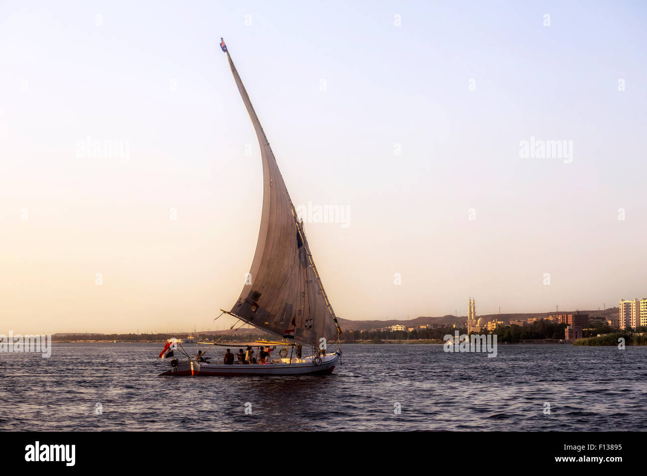 sailing a felucca on the Nile in sunset near Aswan, Egypt, Africa Stock ...