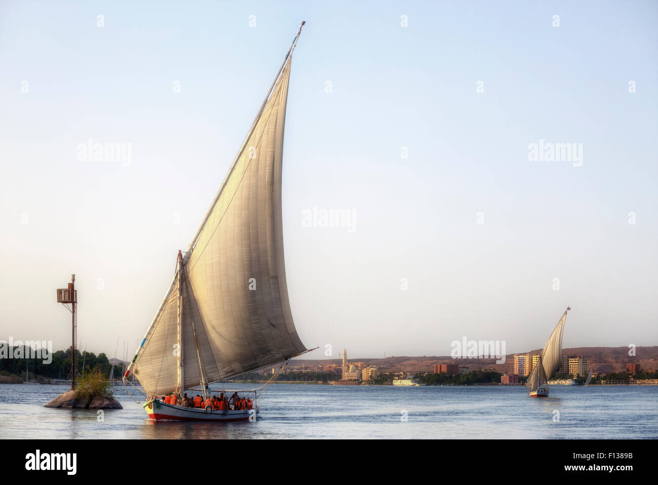 sailing a felucca on the Nile in sunset near Aswan, Egypt, Africa Stock ...
