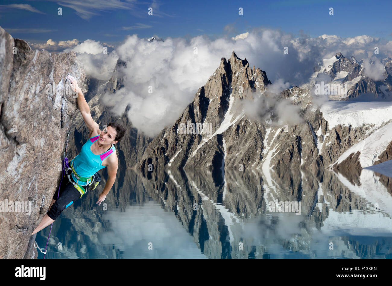 Female extreme climber hanging on cliff over the lake Stock Photo - Alamy