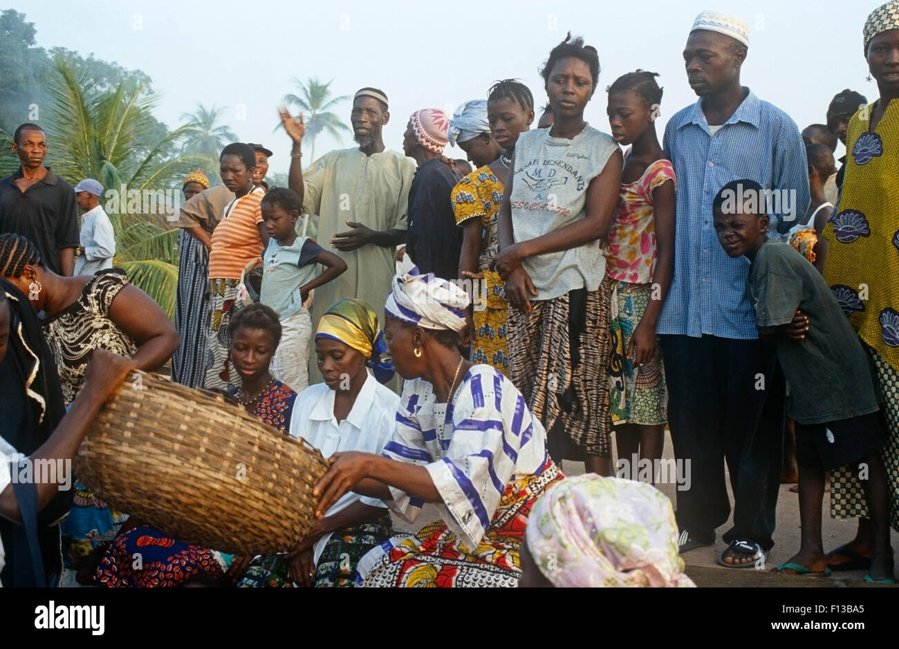 Port villagers awaiting river transport. Port Loko, Sierra Leone, 2004 ...
