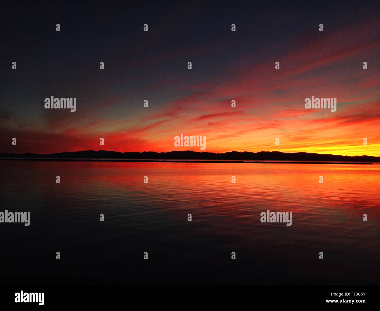 Dramatic sunset over sea Stock Photo - Alamy