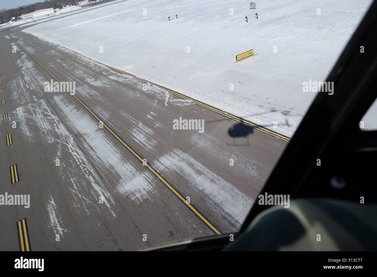 Helicopter shadow on runway seen from the cockpit Stock Photo - Alamy