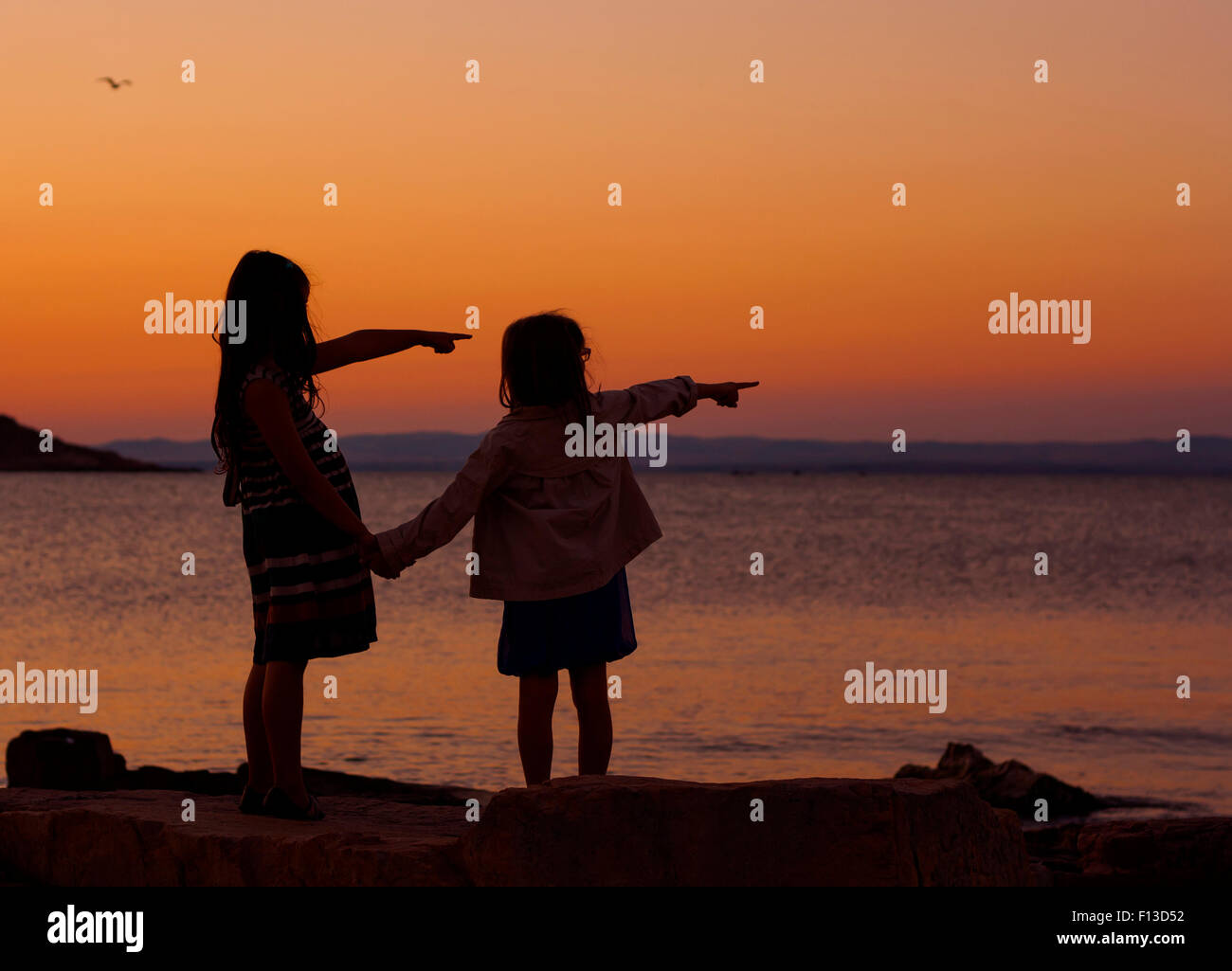 Silhouette Of Two Girls At Sunset High Resolution Stock Photography and ...