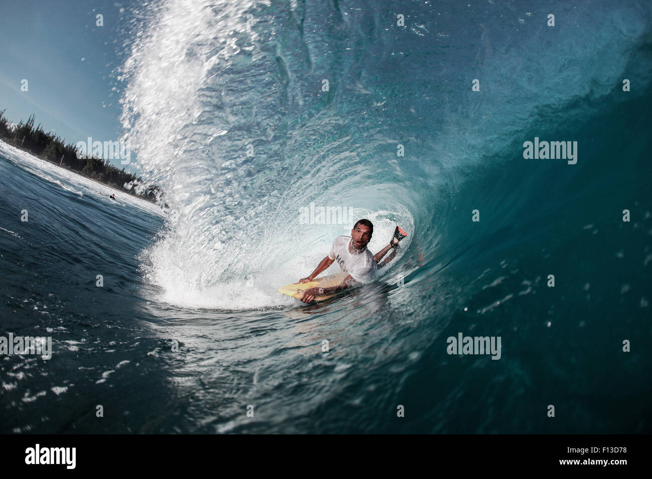 Bodyboarder riding through tube wave hi-res stock photography and ...