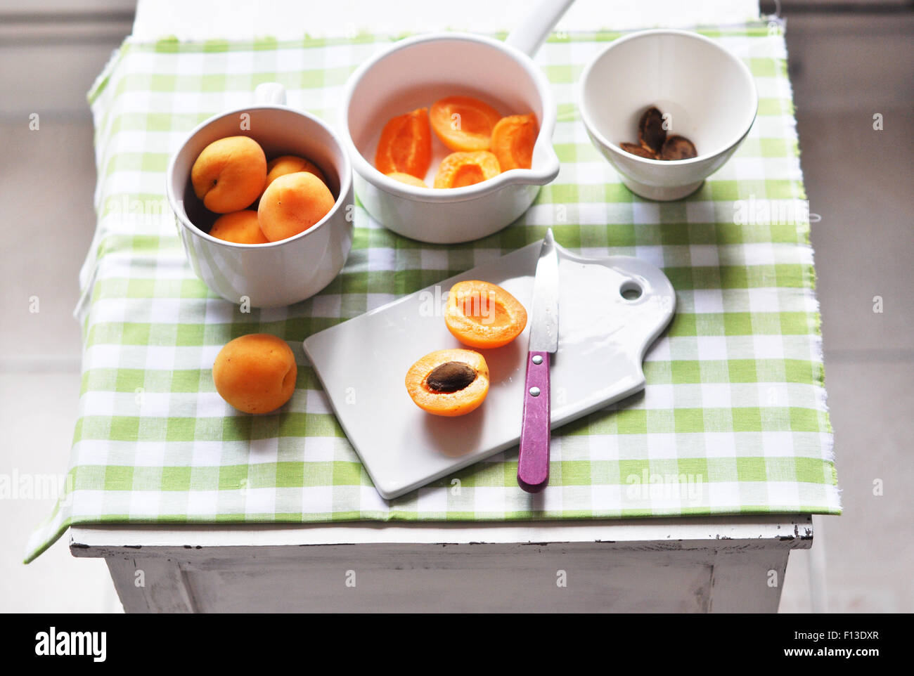 Apricots on a kitchen table Stock Photo - Alamy