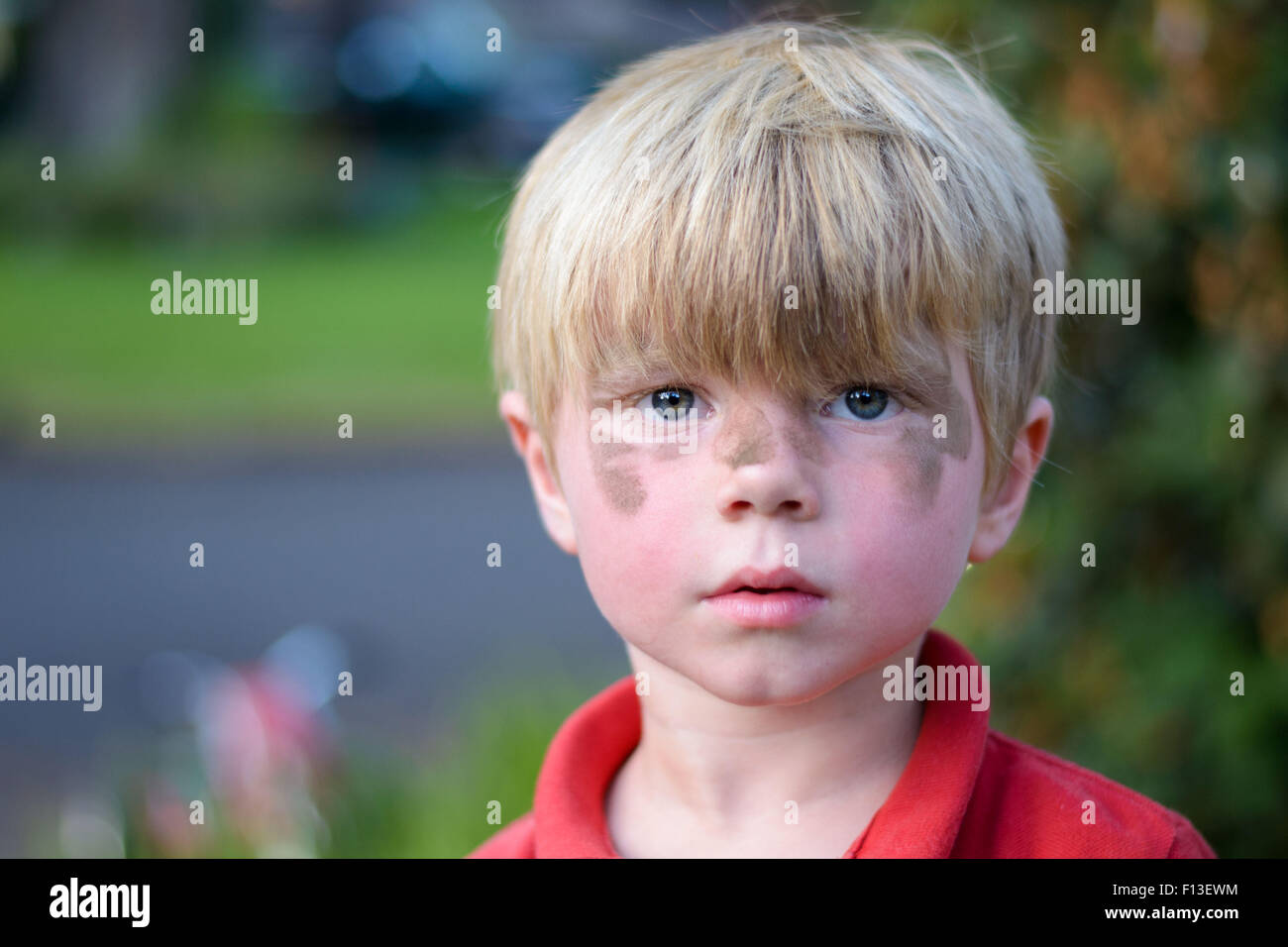 Portrait of a boy with dirt on his face Stock Photo - Alamy