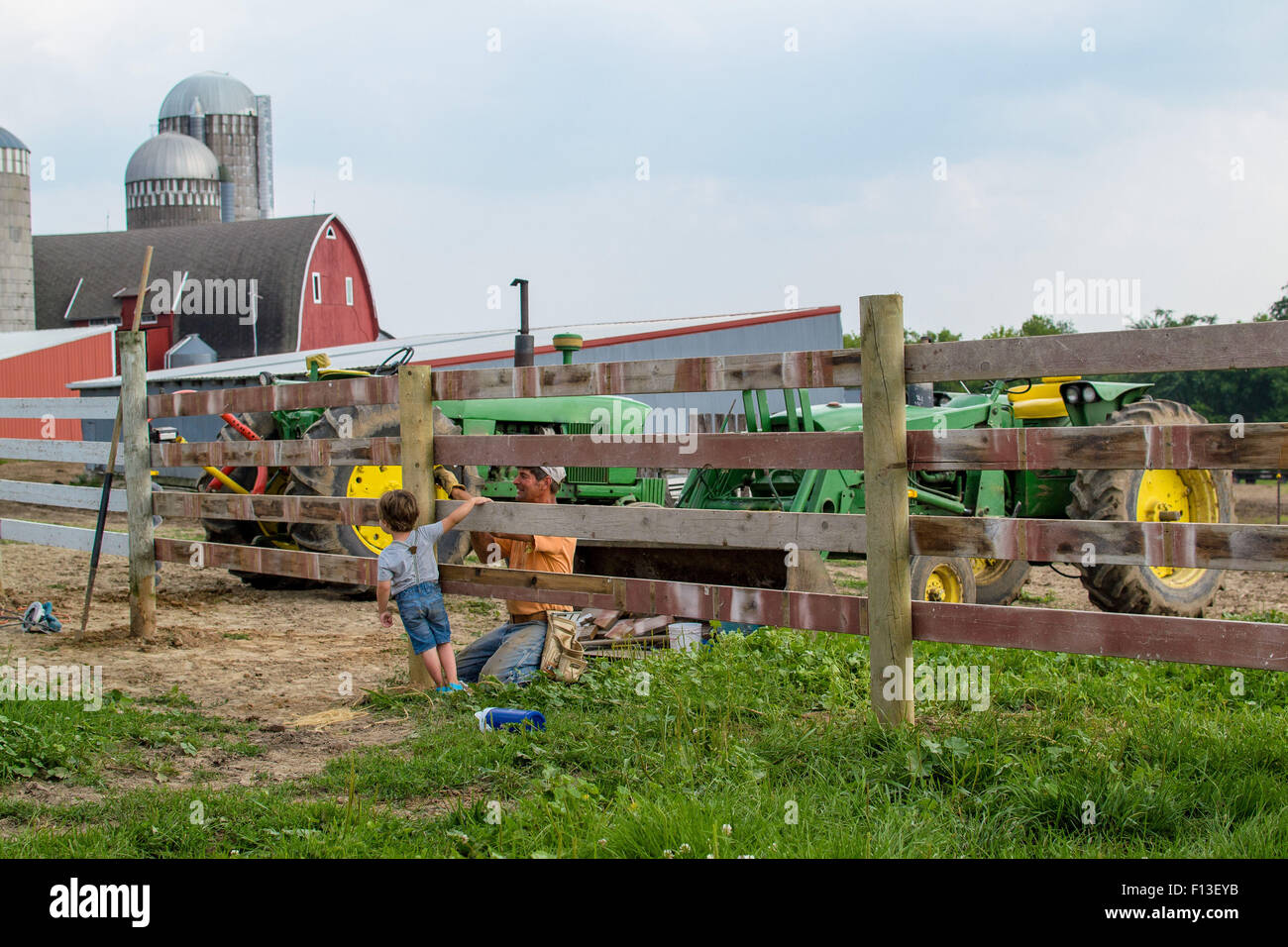 Man helping boy hi-res stock photography and images - Alamy