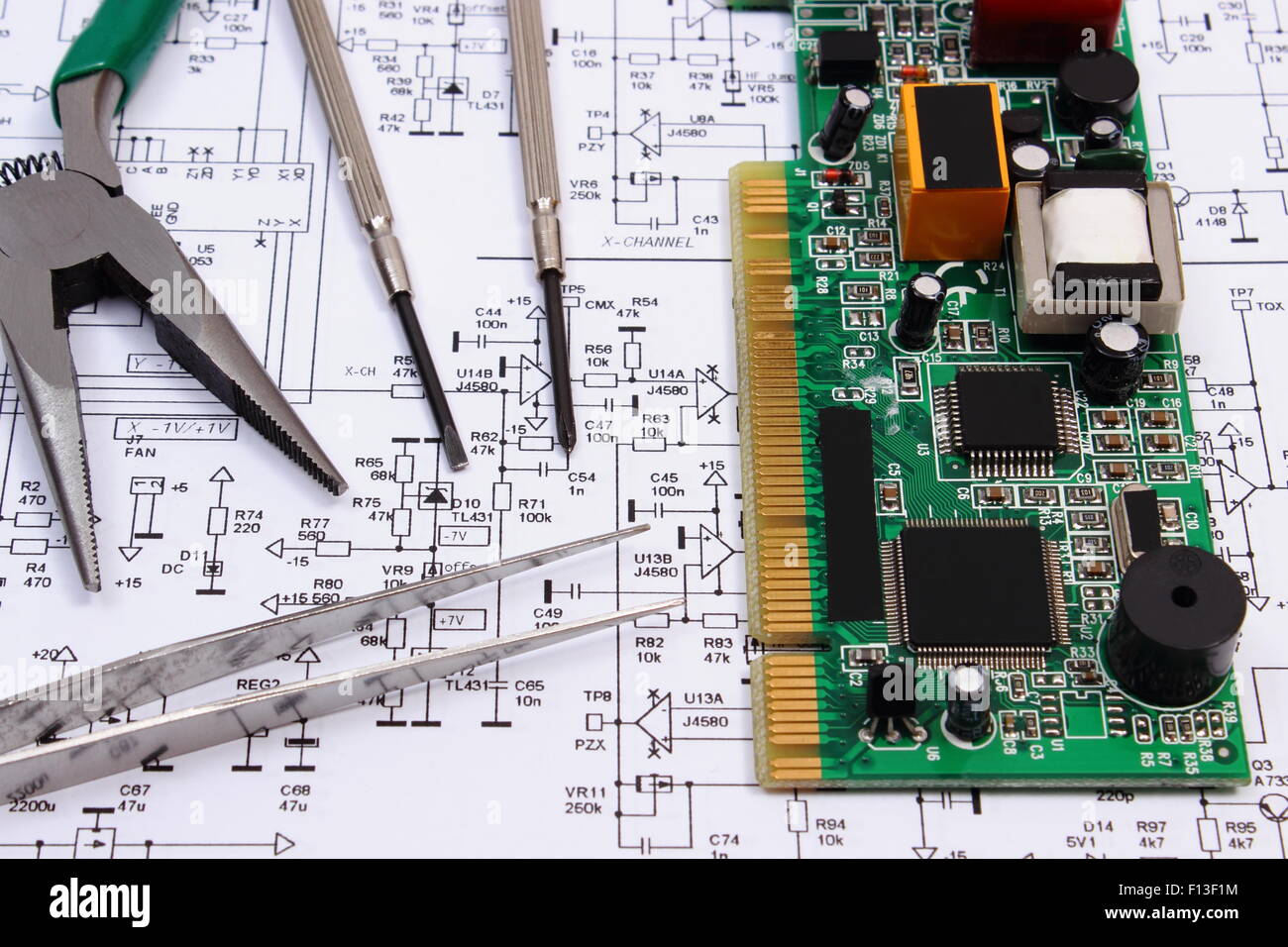 Printed circuit board with electrical components and precision tools ...