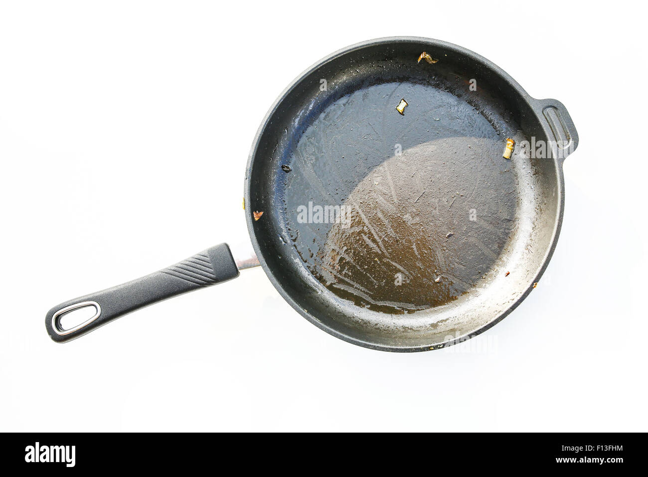 A dirty pan isolated on white Stock Photo - Alamy