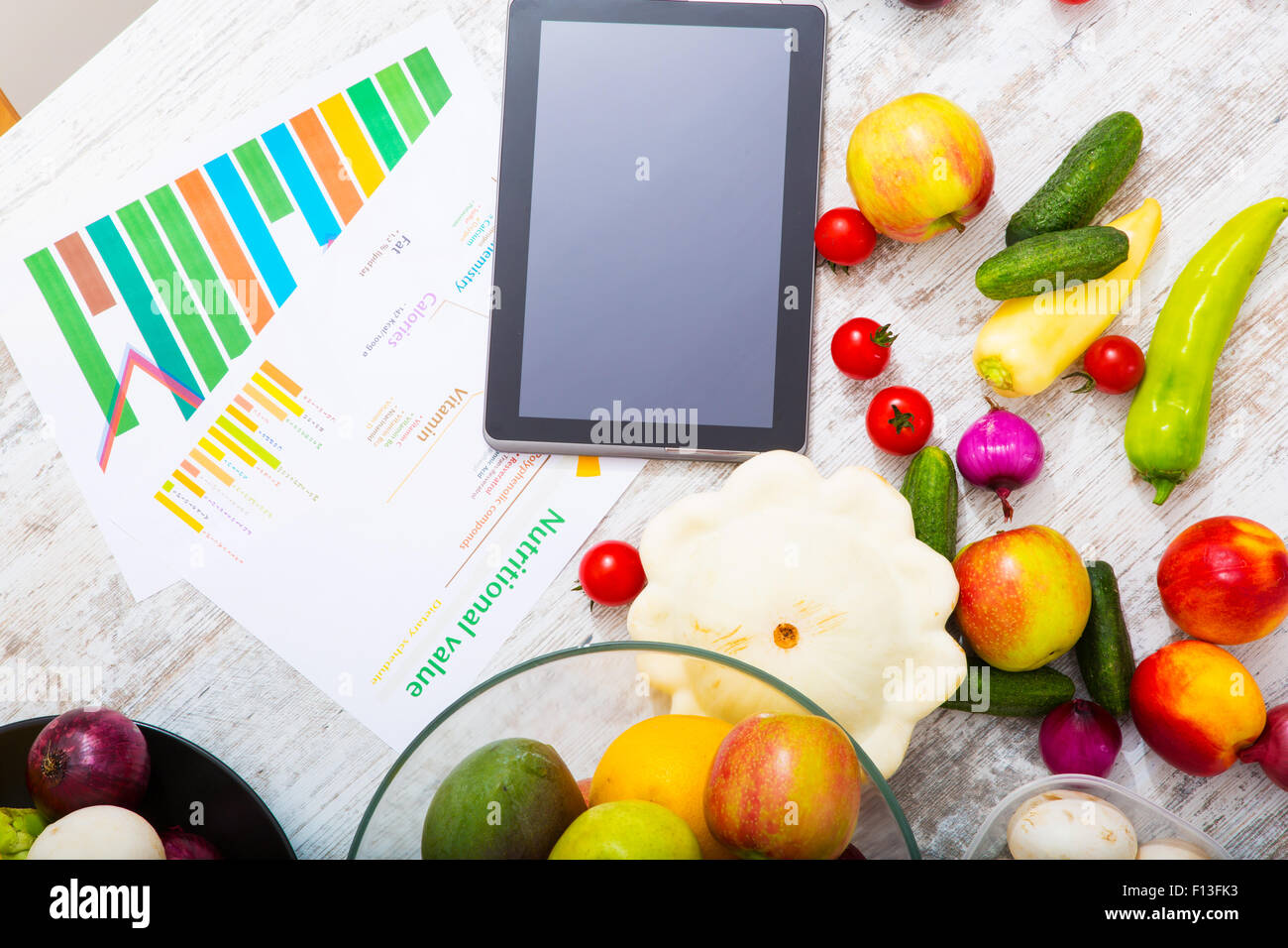 Organic fruit and vegetable on the table with a tablet PC Stock Photo ...