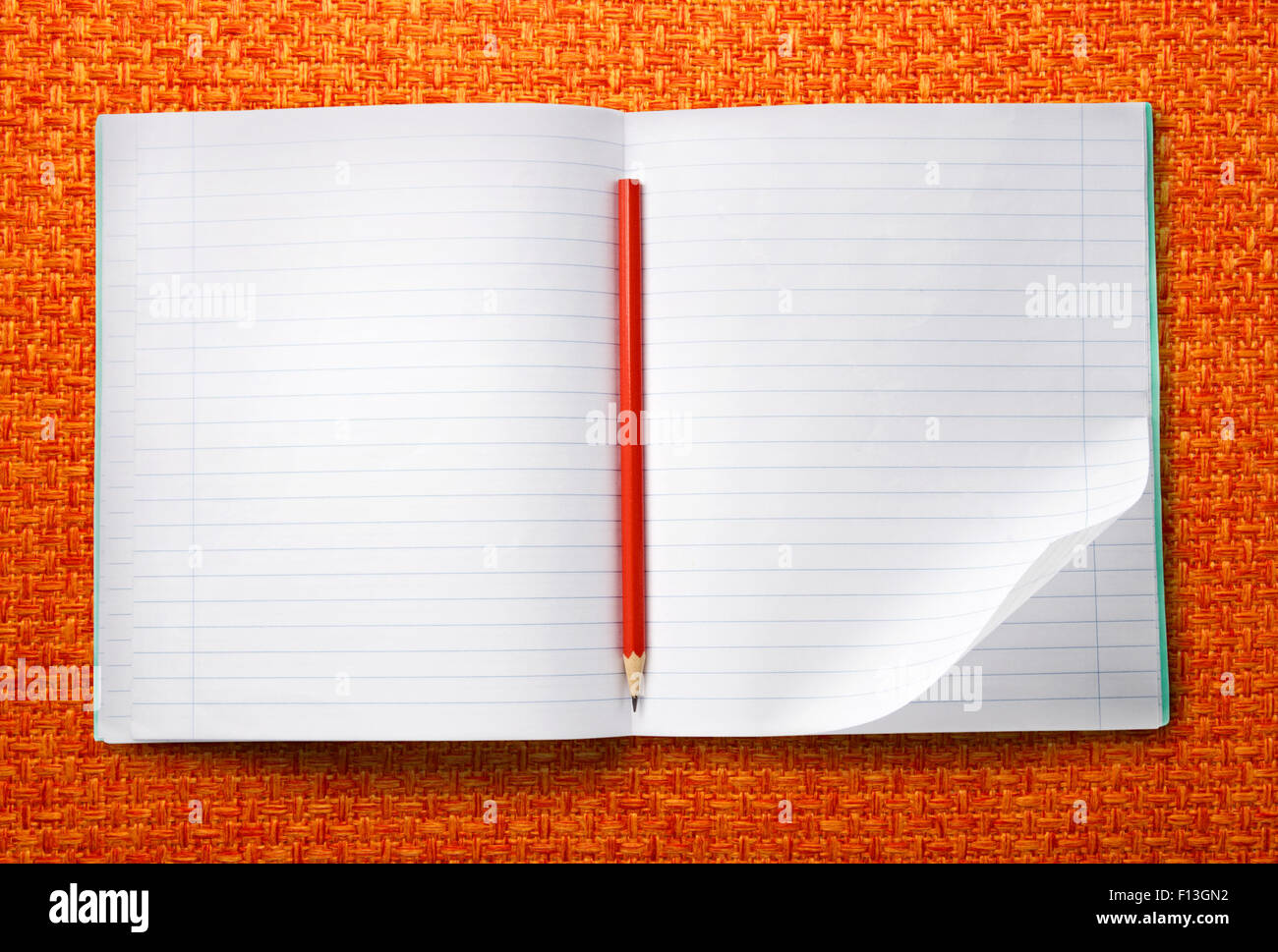 White blank open notebook with red pencil Stock Photo - Alamy