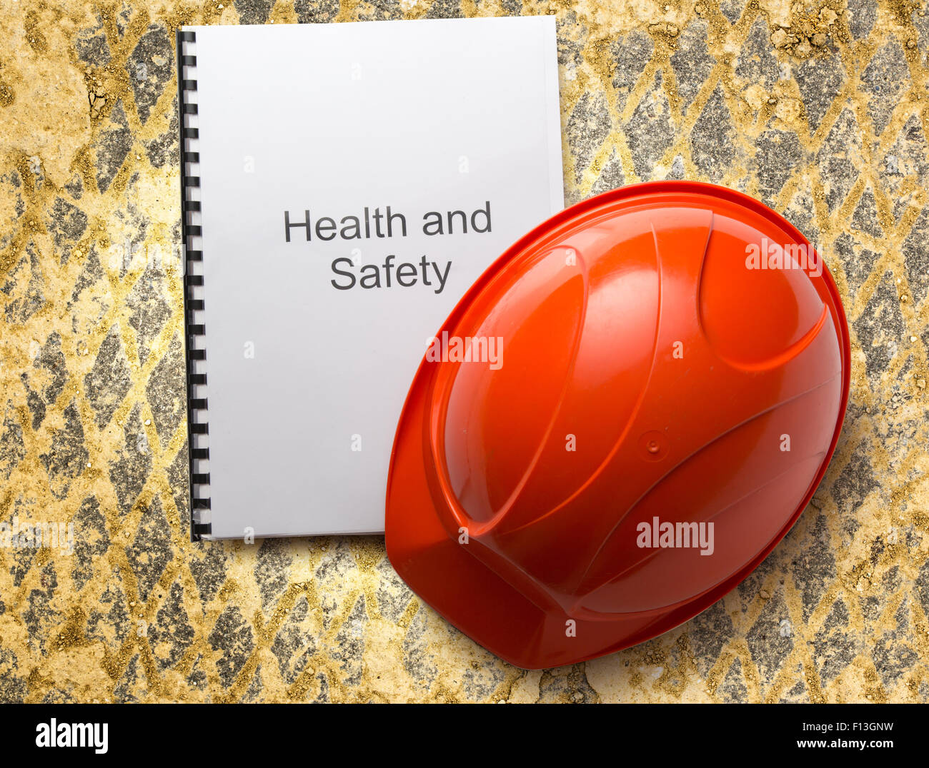 Health and safety register with helmet in closeup Stock Photo - Alamy