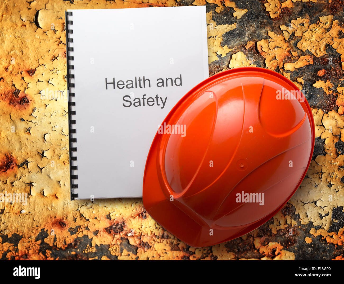 Health and safety register with helmet in closeup Stock Photo - Alamy